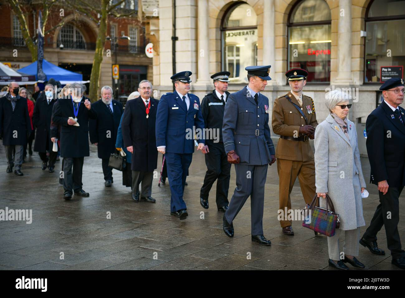 Col. Brian Filler, 501st Combat Support Wing commander, center, walks ...