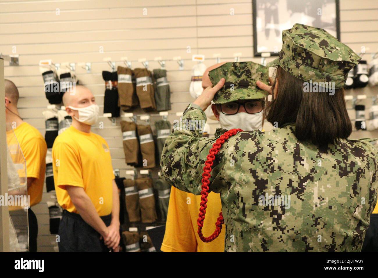 A Recruit Division Commander (RDC) fits an eight-point cover for an ...