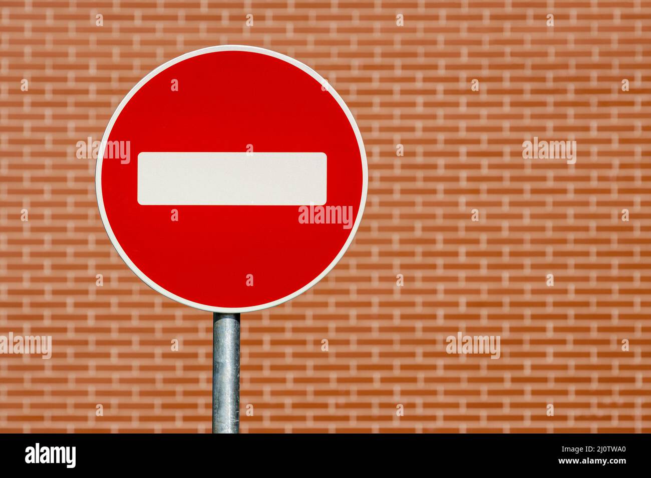 No entry road sign on the brick wall background Stock Photo - Alamy