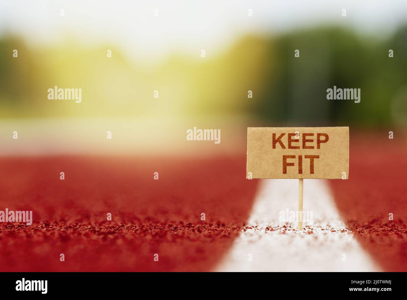 KEEP FIT writing on a text sign on a running track Stock Photo - Alamy