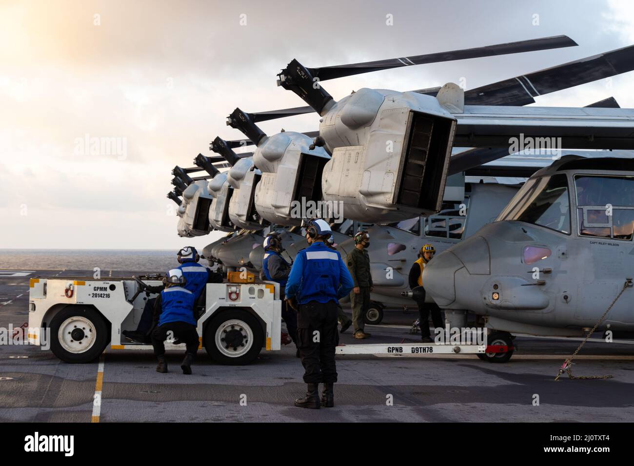 U.S. Navy sailors aboard the amphibious assault ship USS America (LHA 6 ...