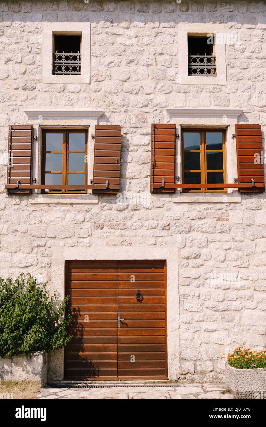 Facade of an old shuttered stone house in Perast. Montenegro Stock ...
