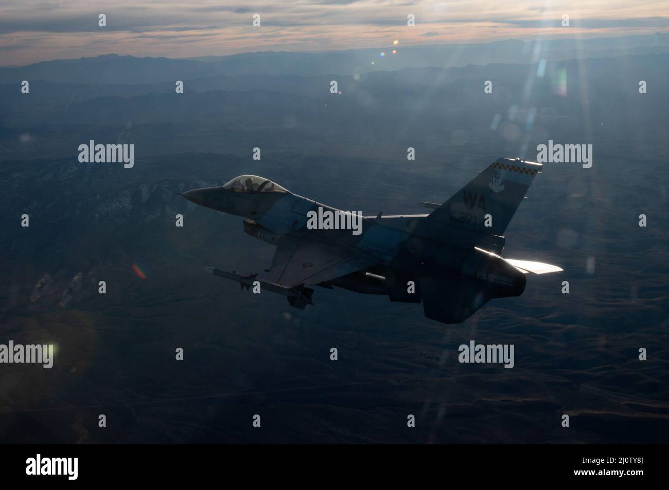 An F-16C Fighting Falcon from the 64th Aggressor Squadron returns back ...