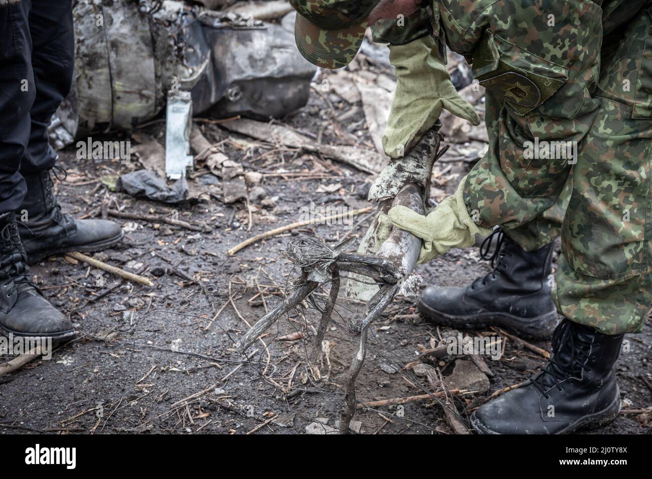 Military specialists and pyrotechnics collect and analyze the remains ...