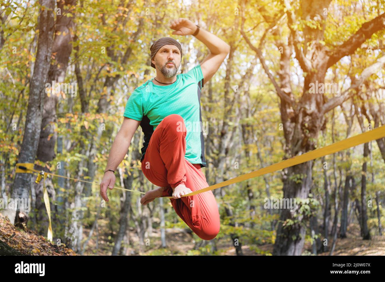 Man balancing on rope hi-res stock photography and images - Alamy