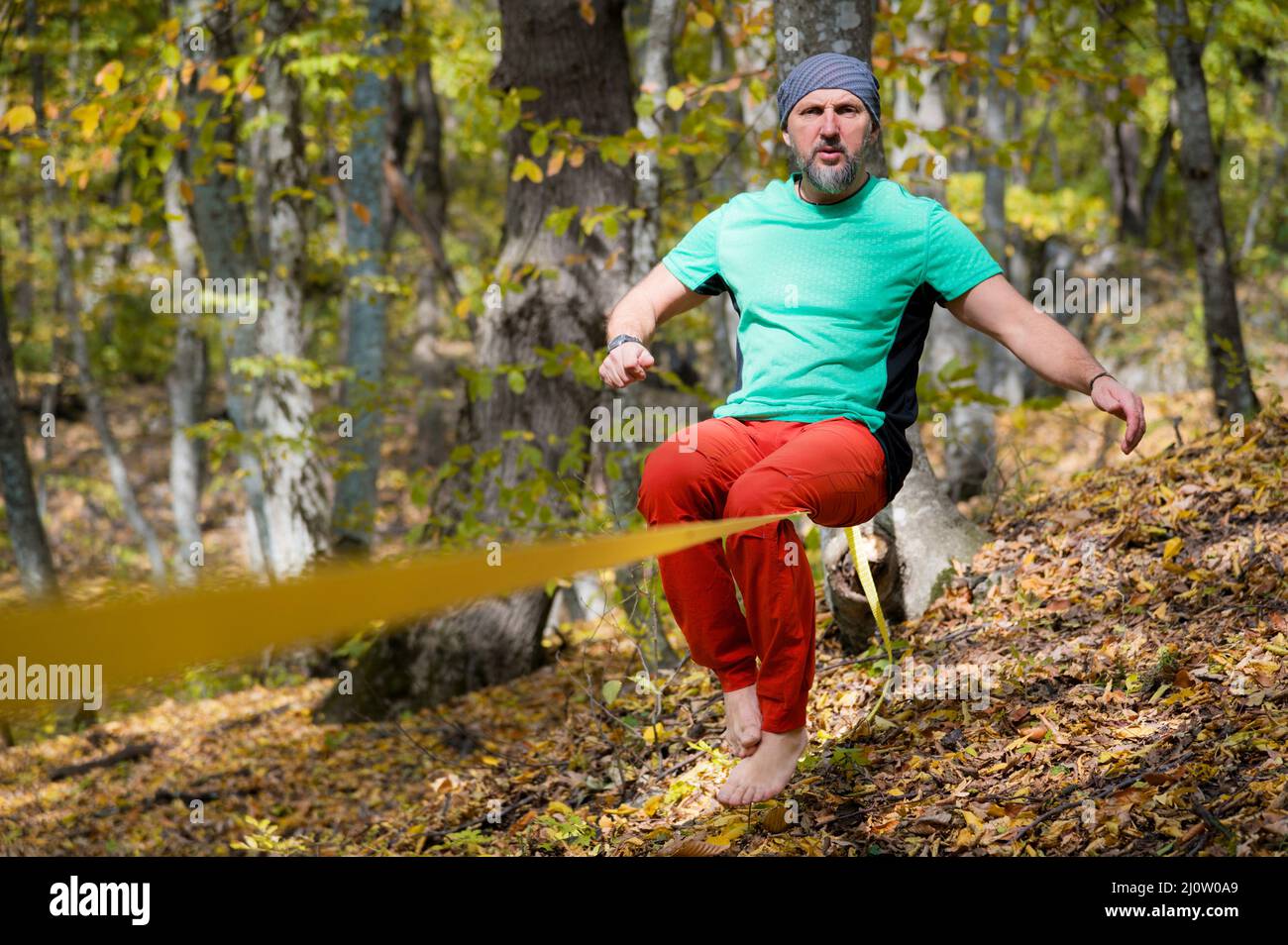 Man balancing on rope hi-res stock photography and images - Alamy