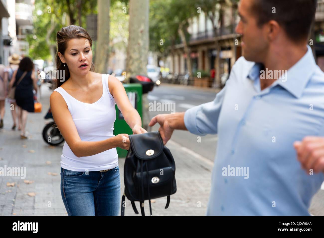 Thief stealing woman bag Stock Photo - Alamy
