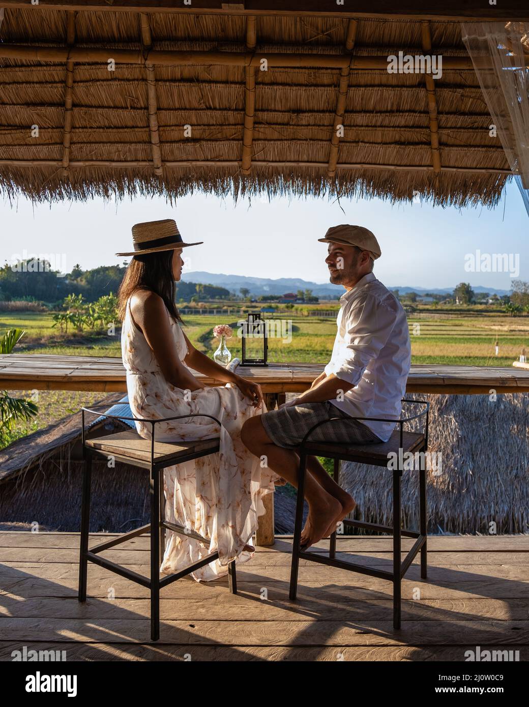 Couple man and woman on vacation in Nan Thailand drinking coffee and ...