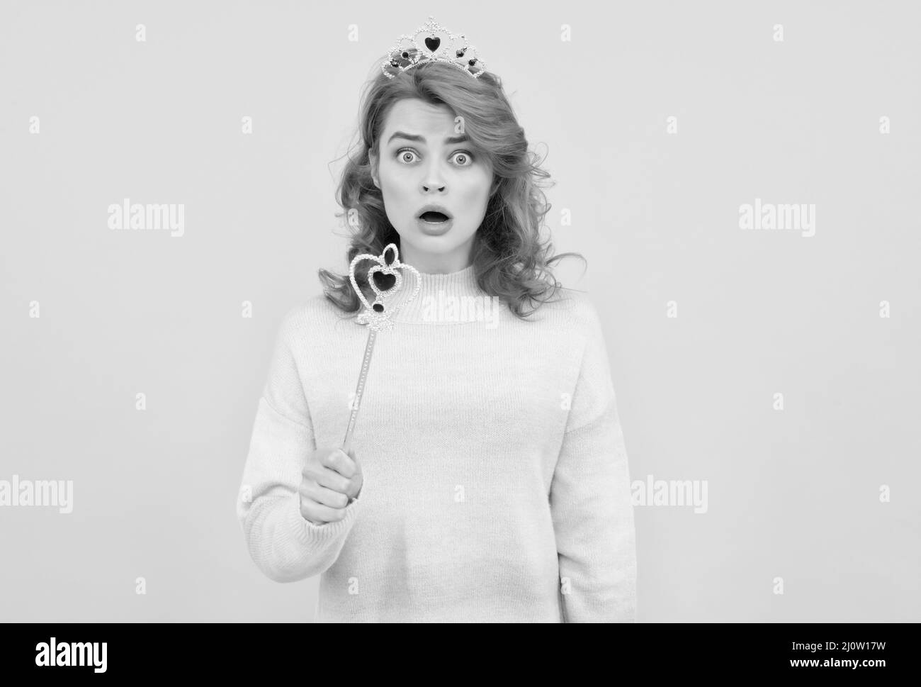 surprised redhead woman in queen crown with magic wand, surprise Stock ...
