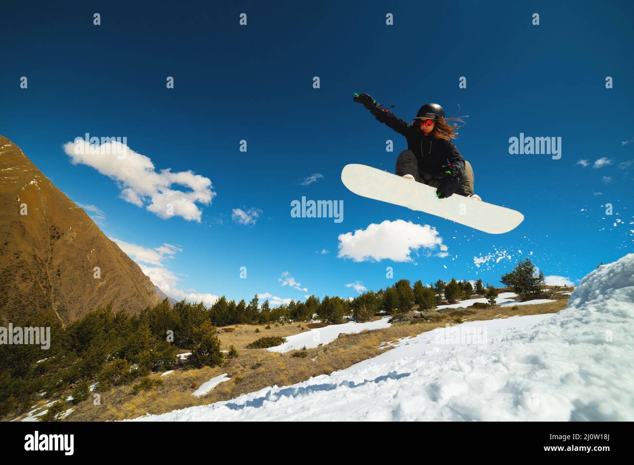 Girl Snowboarding Trick