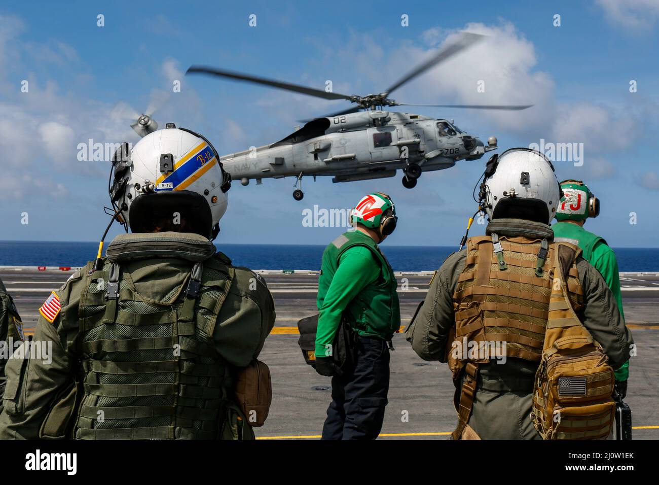SOUTH CHINA SEA (Jan. 30, 2022) Capt. Amy Bauernschmidt, left ...