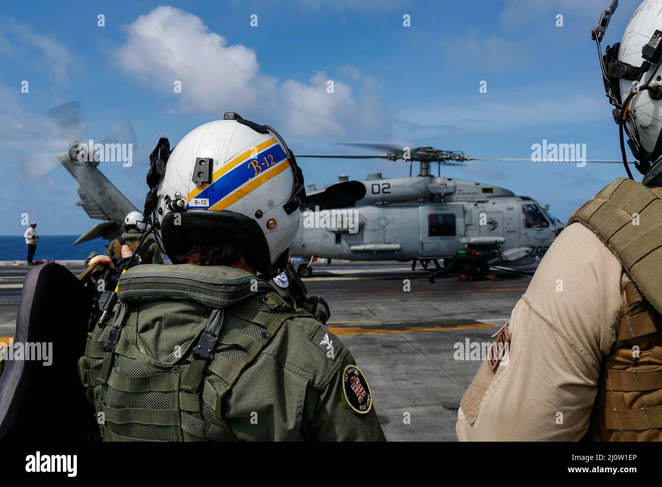 SOUTH CHINA SEA (Jan. 30, 2022) Capt. Amy Bauernschmidt, left ...
