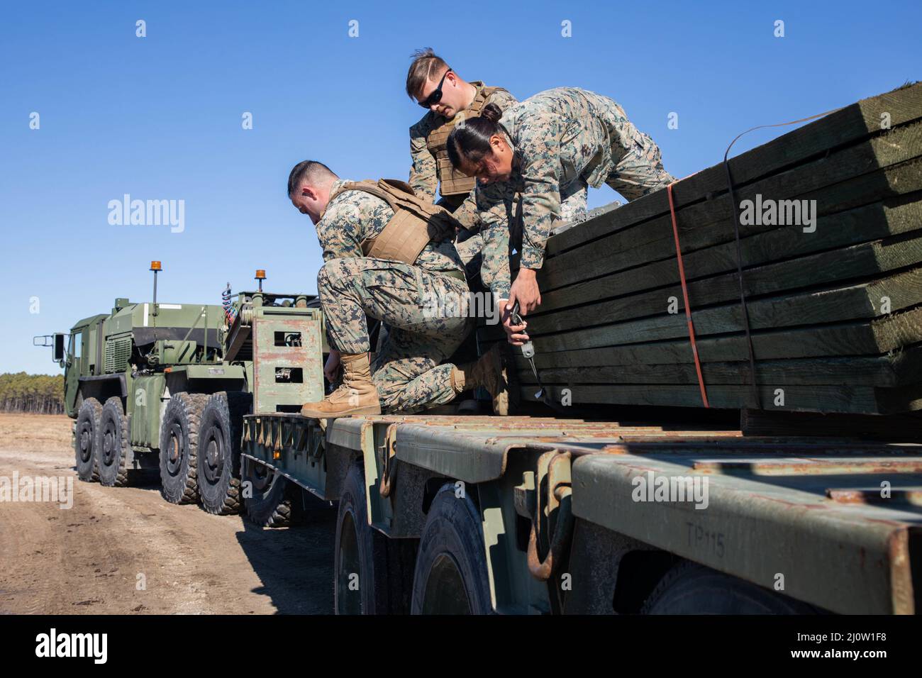 U.S. Marines with 8th Engineer Support Battalion, offload supplies ...