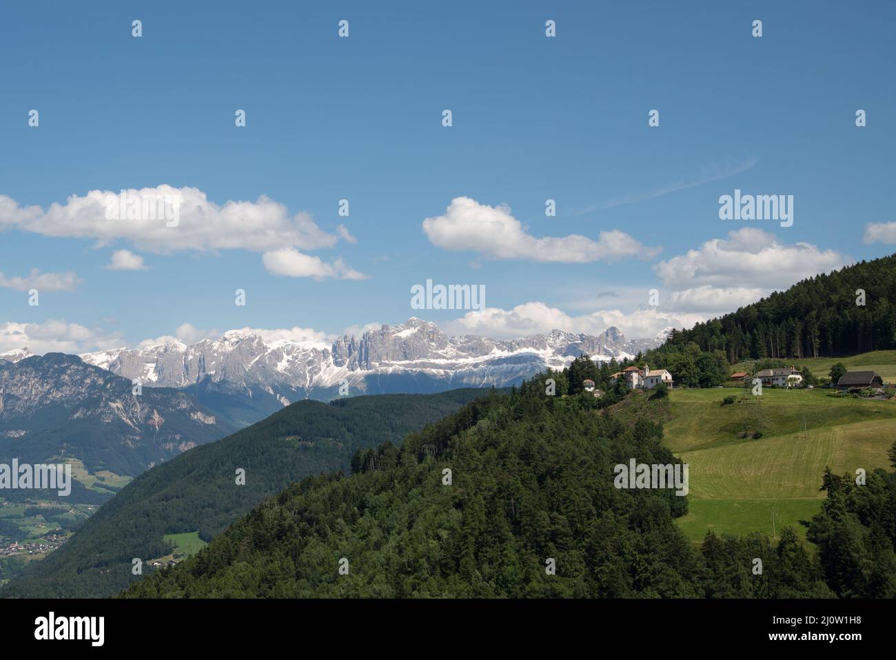 Horizontal scenic landscape of beautiful forest mountains under a blue ...