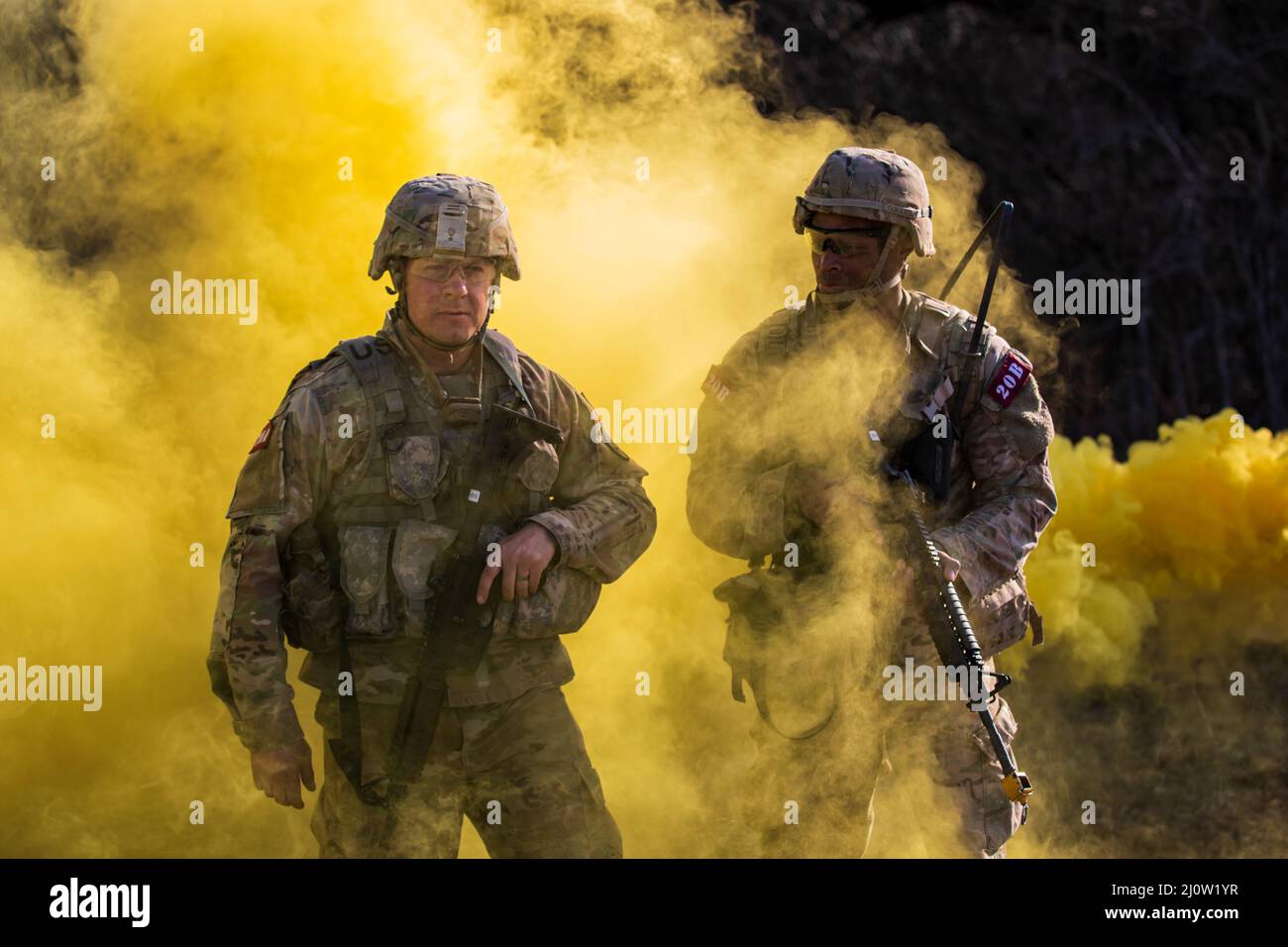 Sgt. 1st Class Garrett Rogers (left) and Staff Sgt. Jephte Guilluame ...