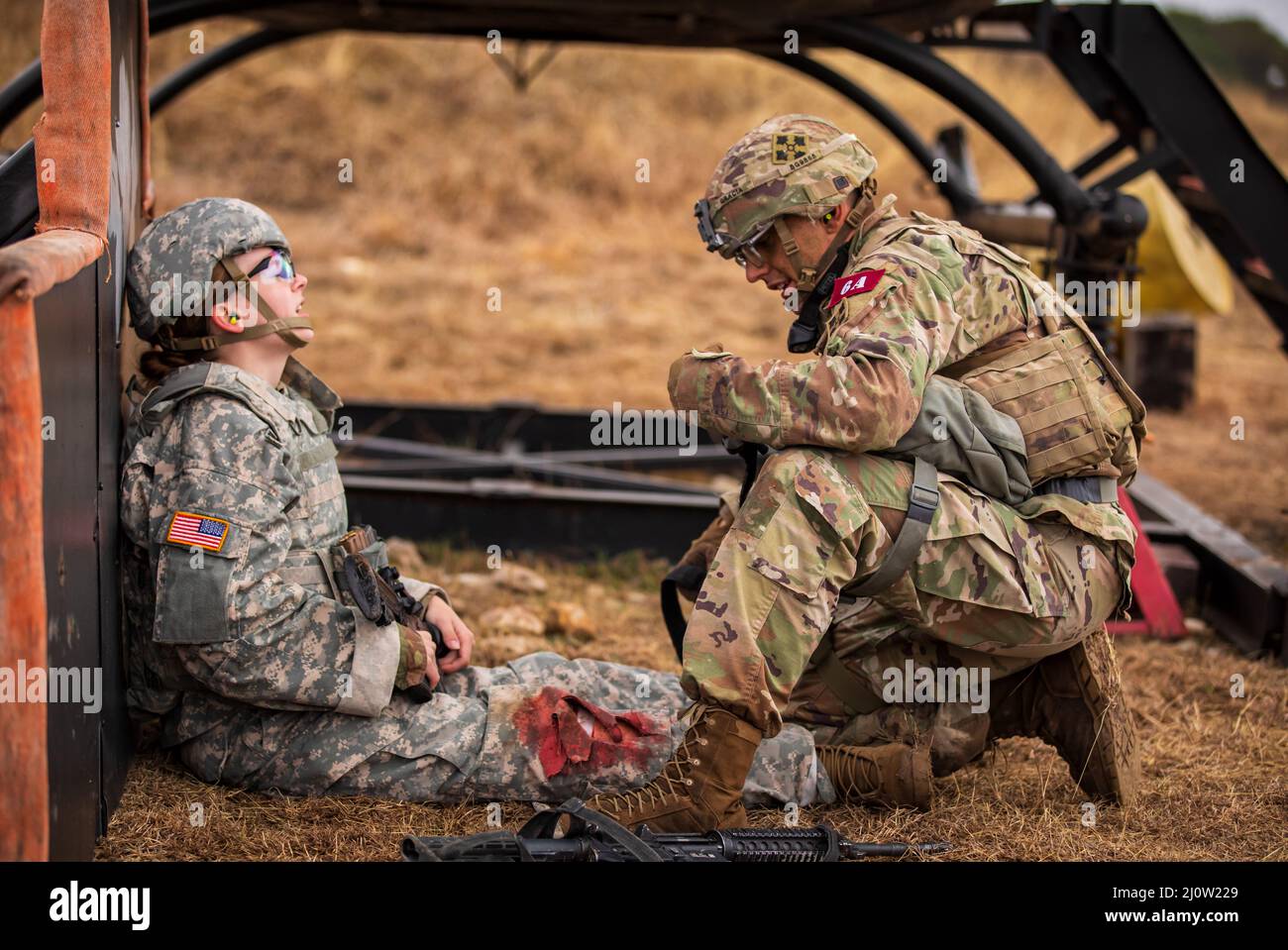 Spc. Brandon Gracia, 4th Infantry Division, treats a simulated casualty ...