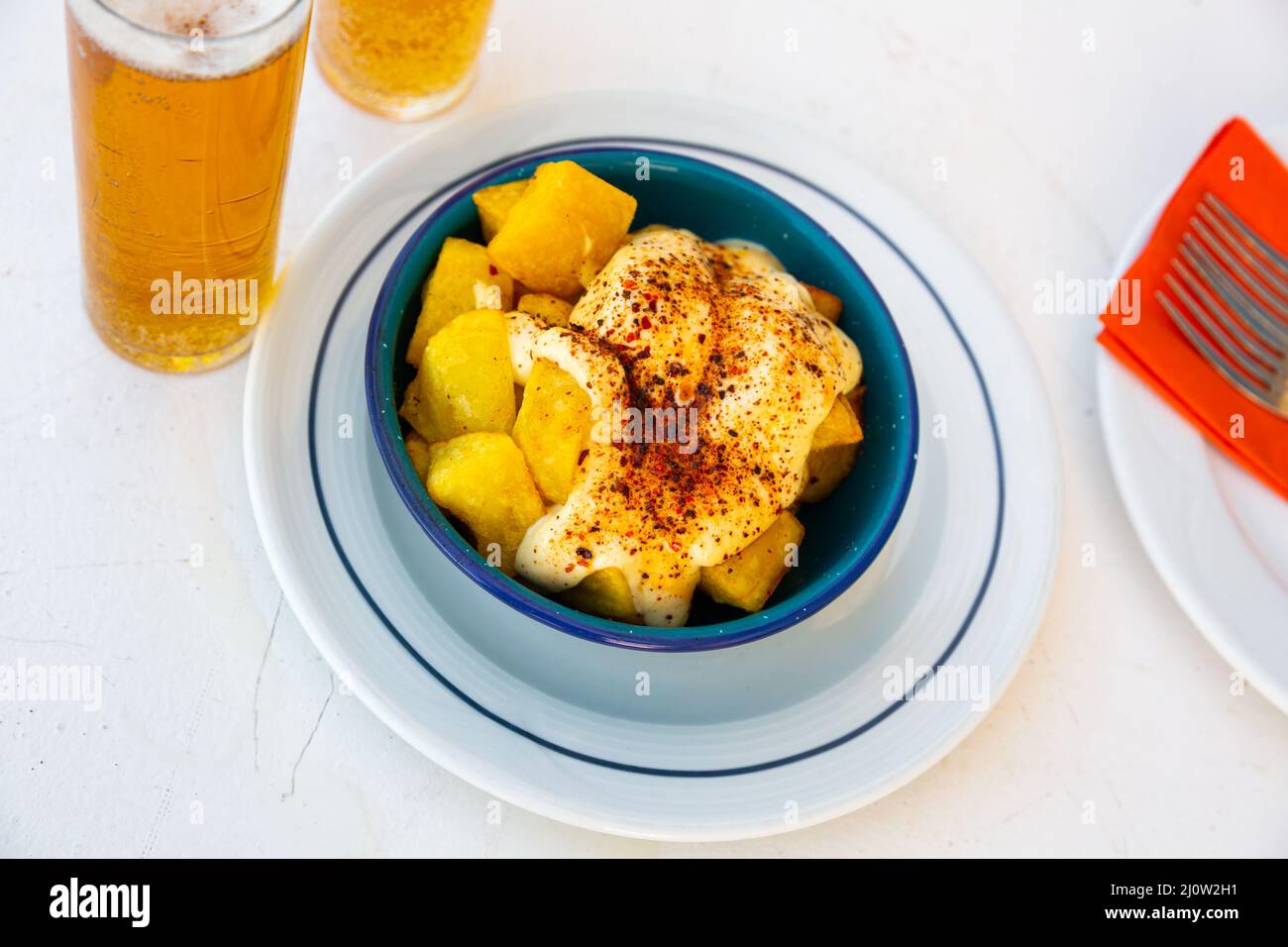 Spanish fried potatoes patatas bravas Stock Photo - Alamy