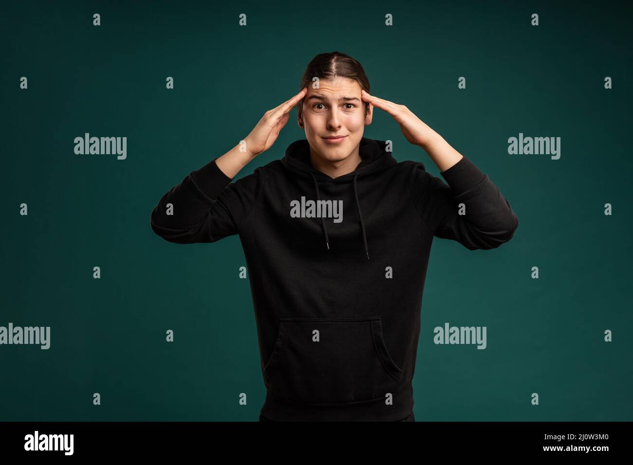 Crazy expression of a young man. Cropped studio portrait of male mood ...