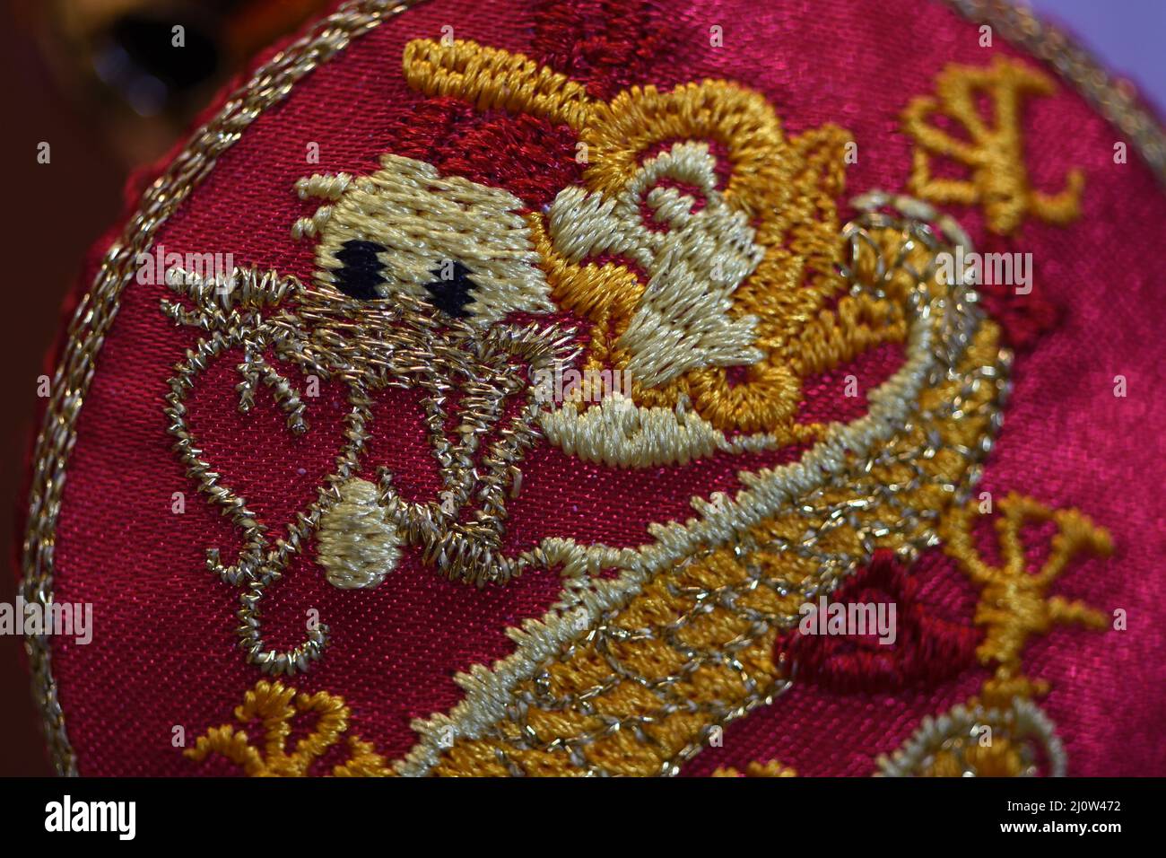 A Chinese dragon embroidered on a small wall hanging Stock Photo - Alamy