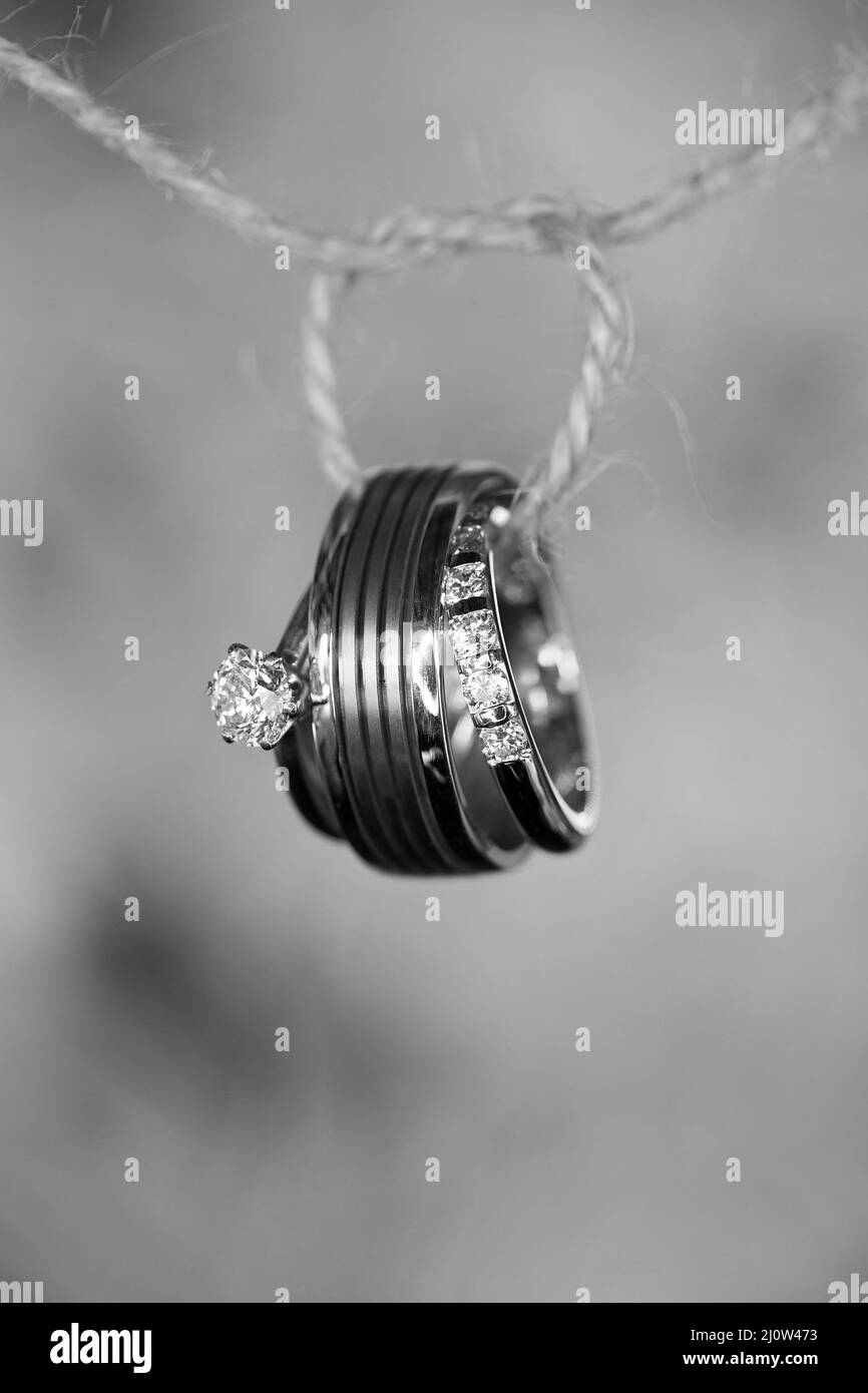 Entwined wedding rings hi-res stock photography and images - Alamy