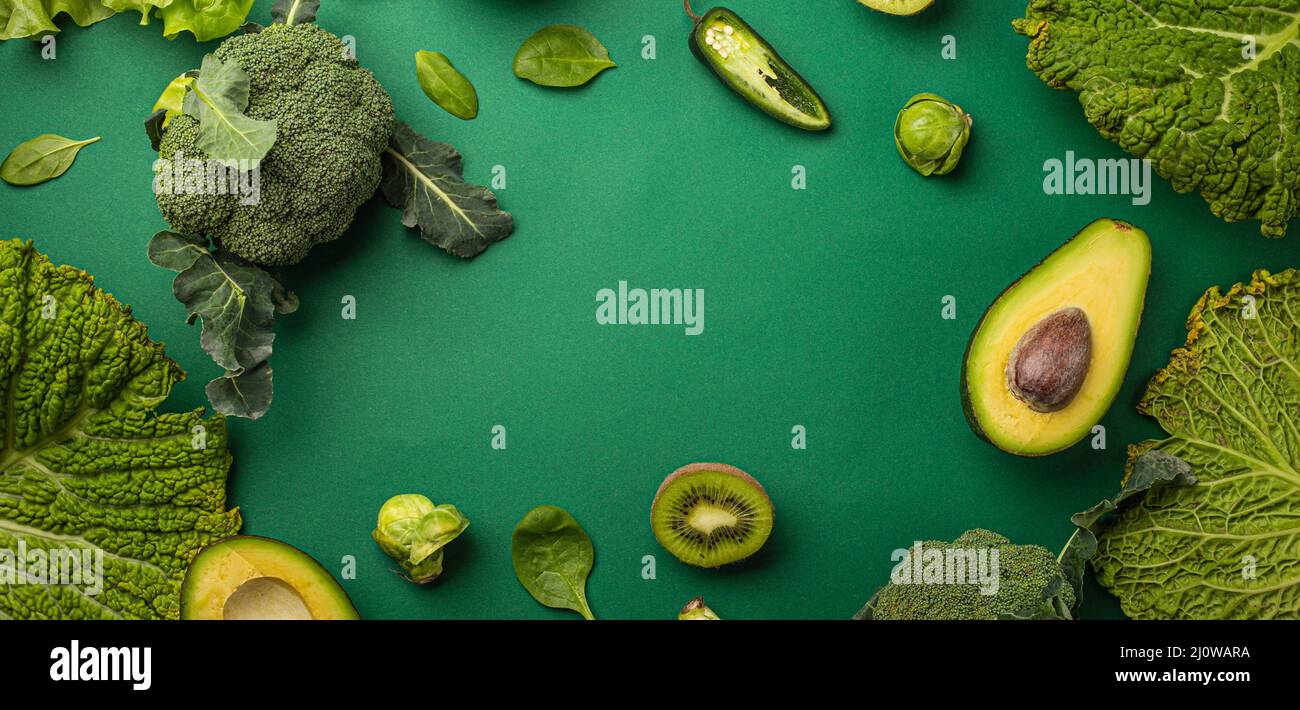 Creative layout food concept made of green fruit and vegetables on ...