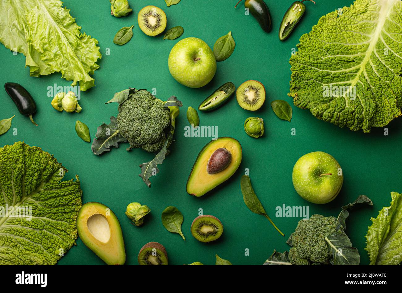 Creative layout food concept made of green fruit and vegetables on ...