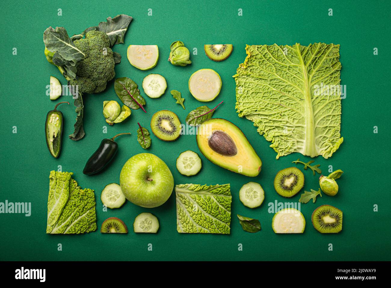 Creative layout food concept made of green fruit and vegetables on ...