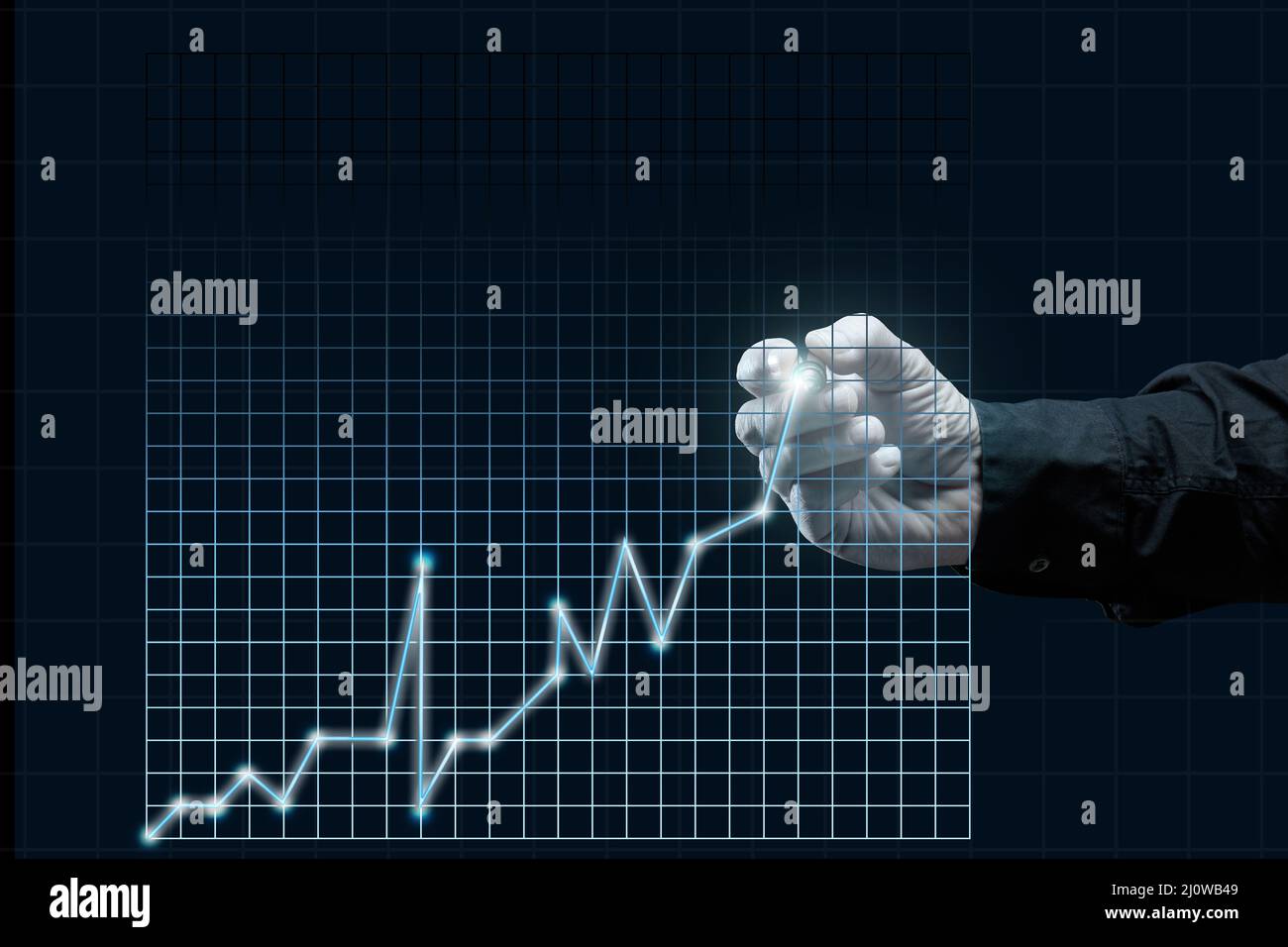 Growing graph on a holographic grid and a man's hand. Business ...
