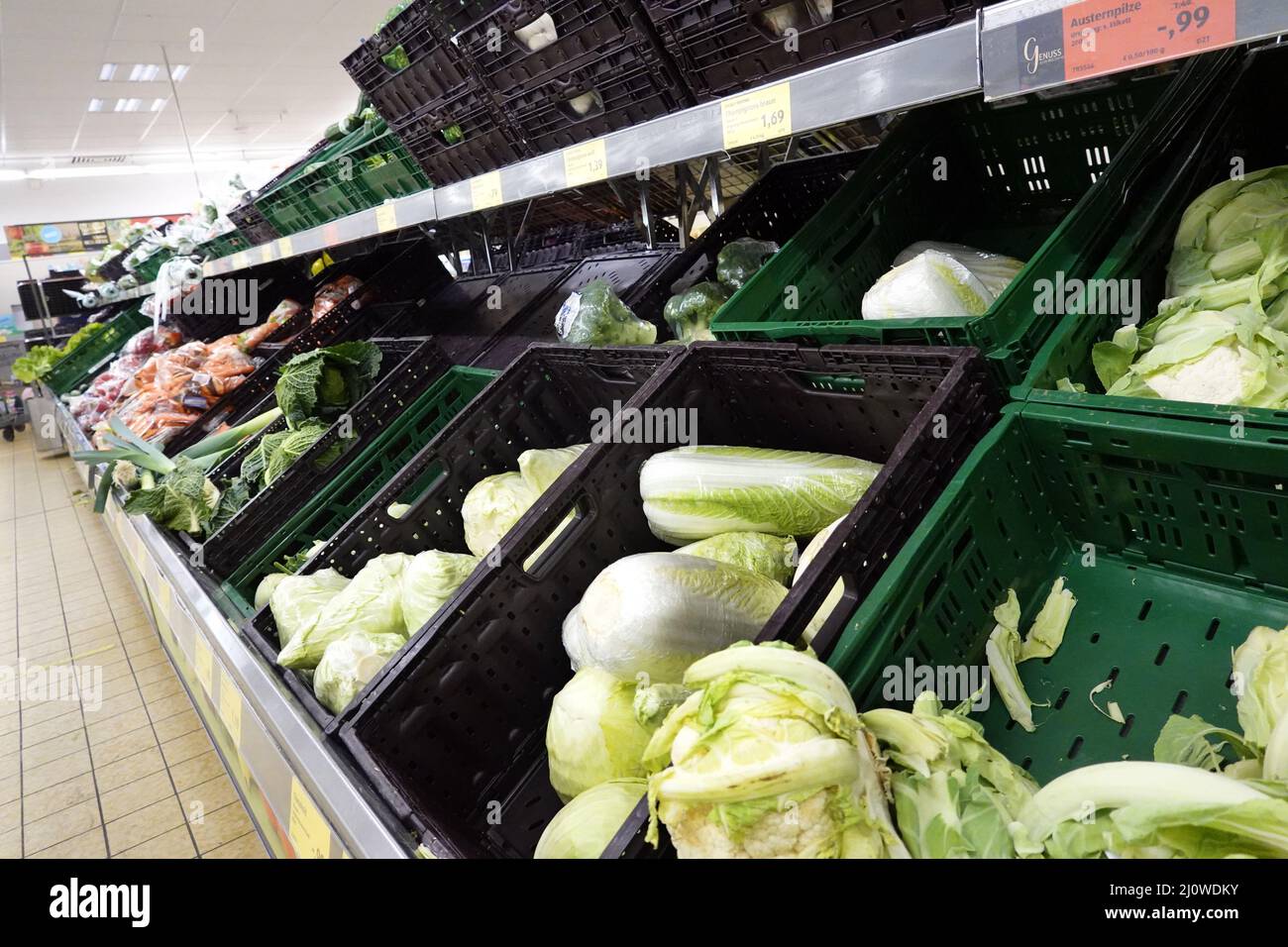 Fruit and vegetable counter at a discounter with a lot of plastic as ...