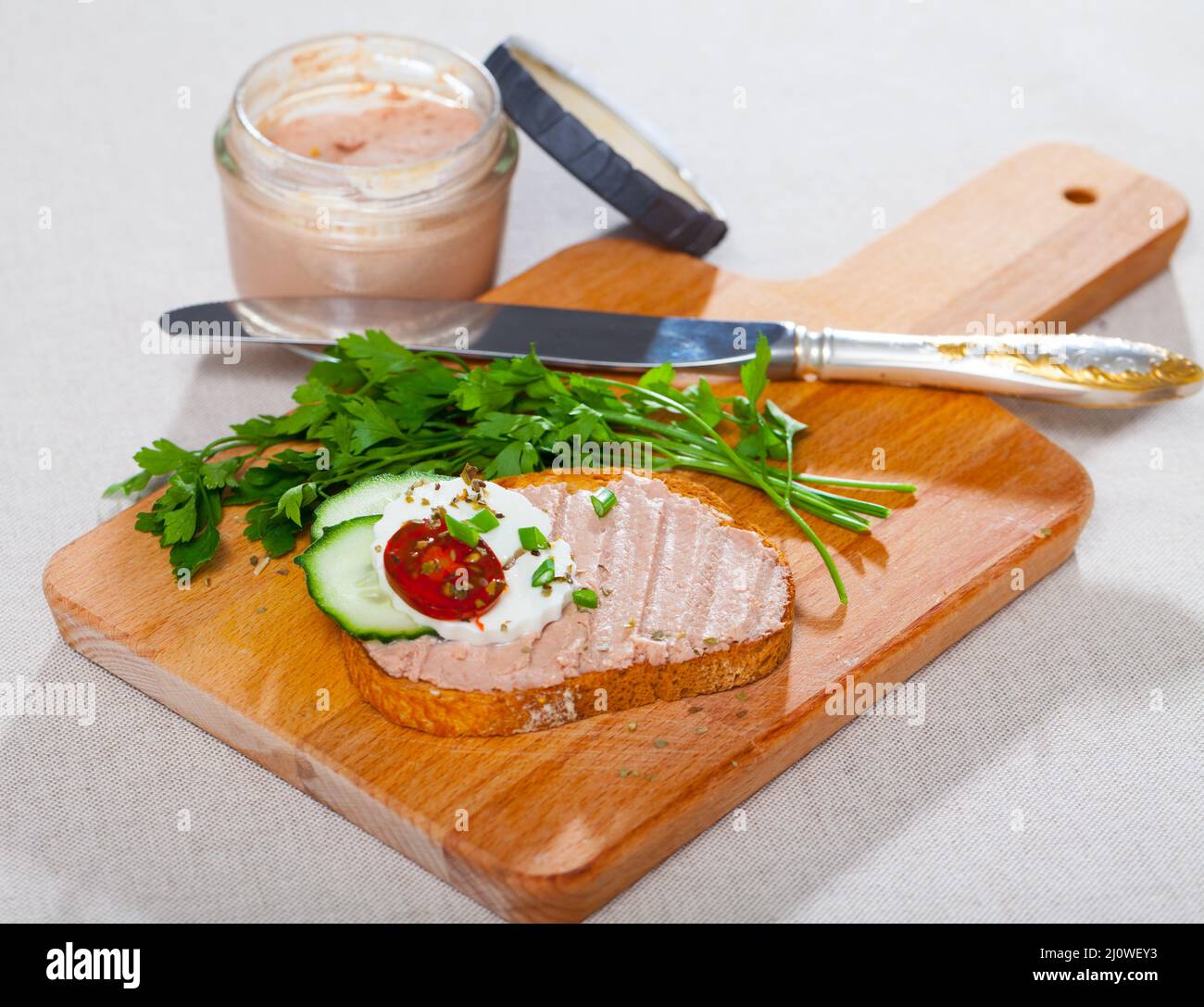 Canape with pate and young cheese at fresh bread, served with greens ...
