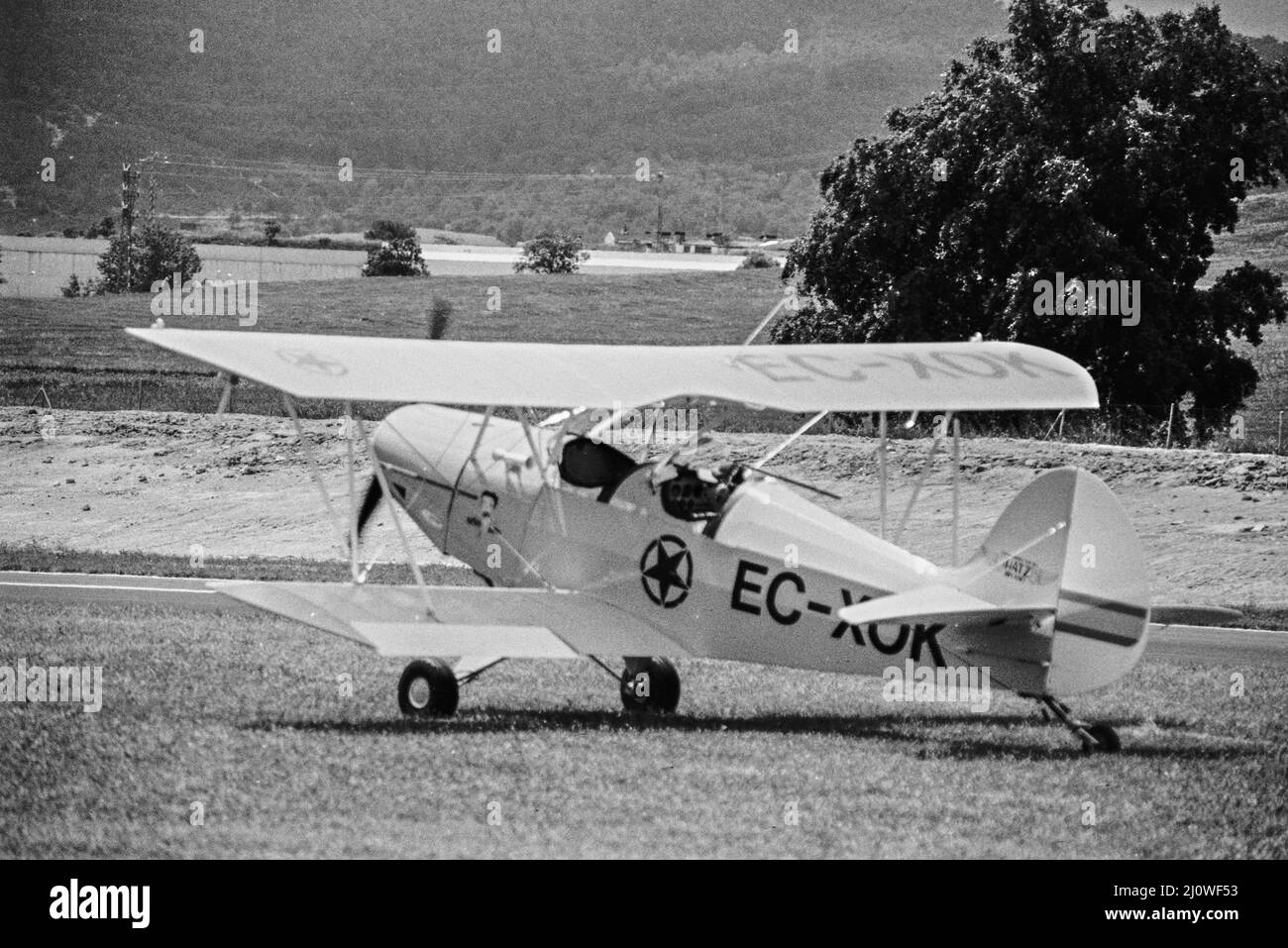Classic biplane yellow color in the aeroclub Stock Photo - Alamy