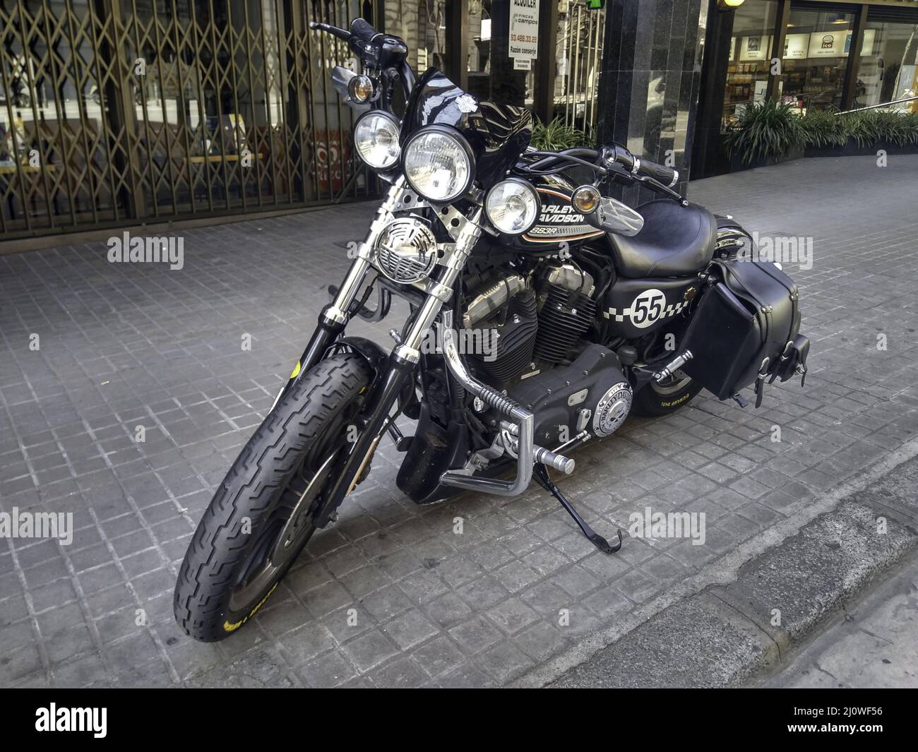 Classic black custom chopper motorbike parked in the street Stock Photo ...