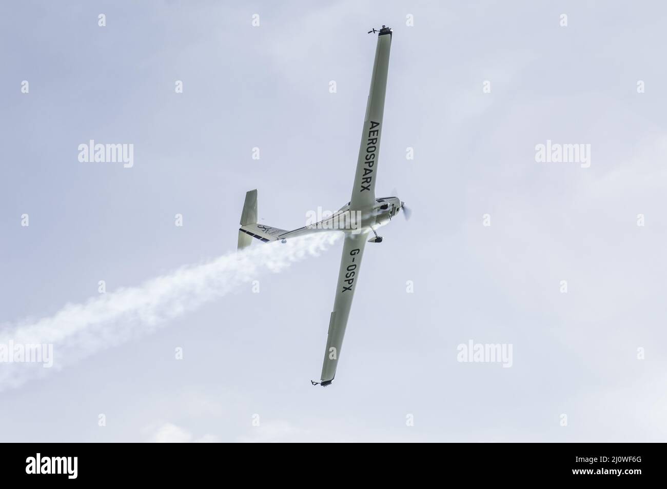 Twin plane acrobatics performance in the sky with smoke Stock Photo - Alamy