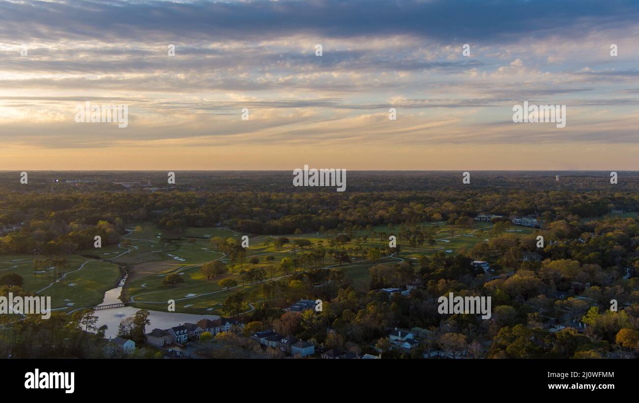 Aerial view of the Country Club of Mobile golf course at sunset in ...