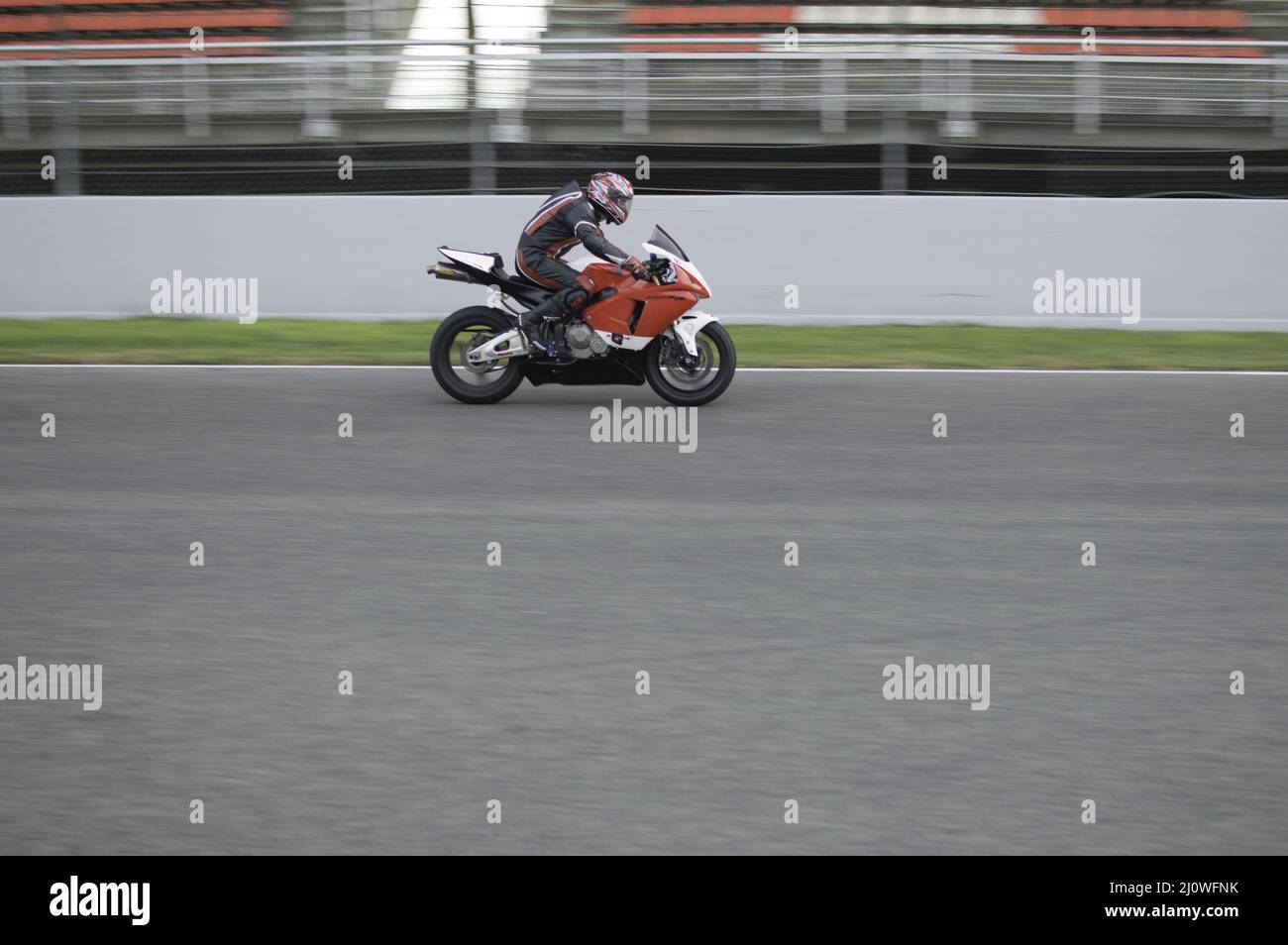 Classic racing sport motorbike running in the asphalt track Stock Photo ...