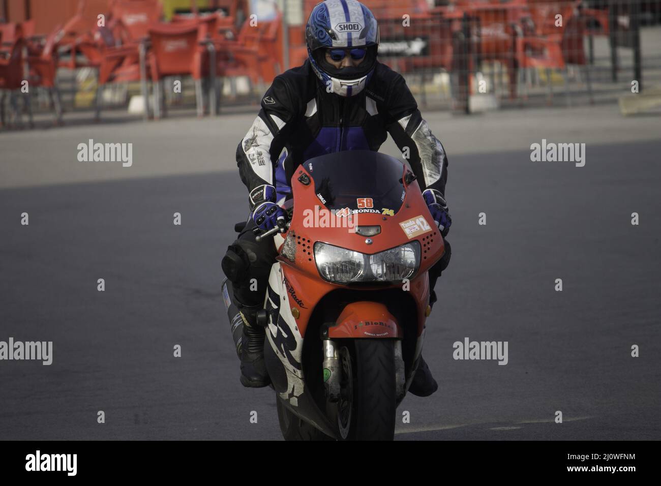 Classic racing sport motorbike running in the asphalt track Stock Photo ...