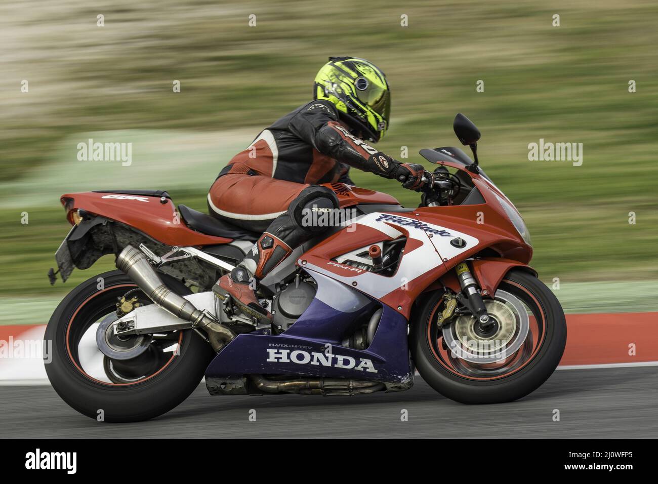Classic racing sport motorbike running in the asphalt track Stock Photo ...