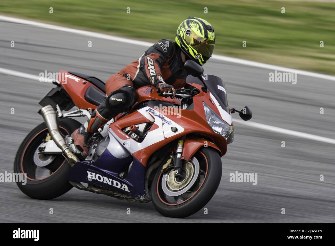 Classic racing sport motorbike running in the asphalt track Stock Photo ...