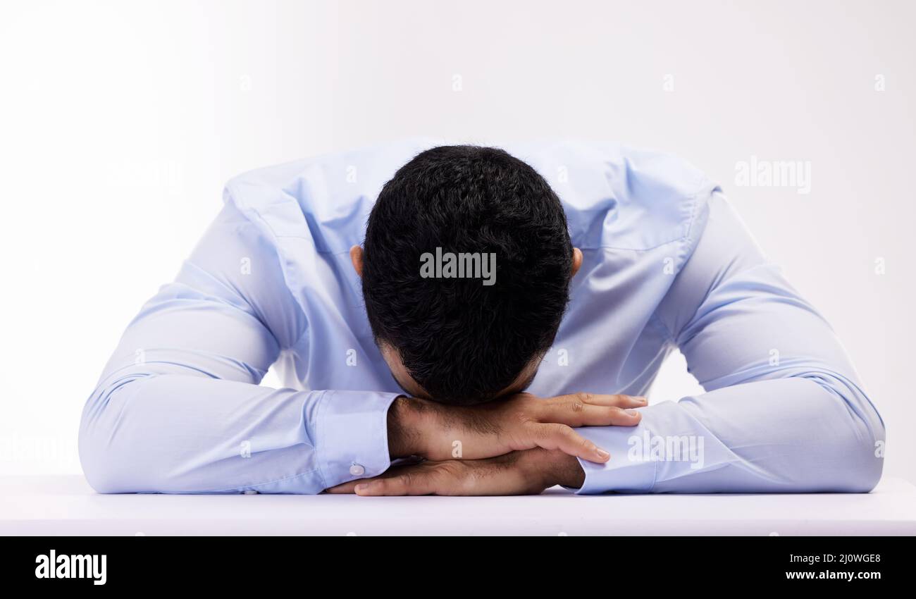 Bored, stressed and feeling like a total mess. Studio shot of a young ...