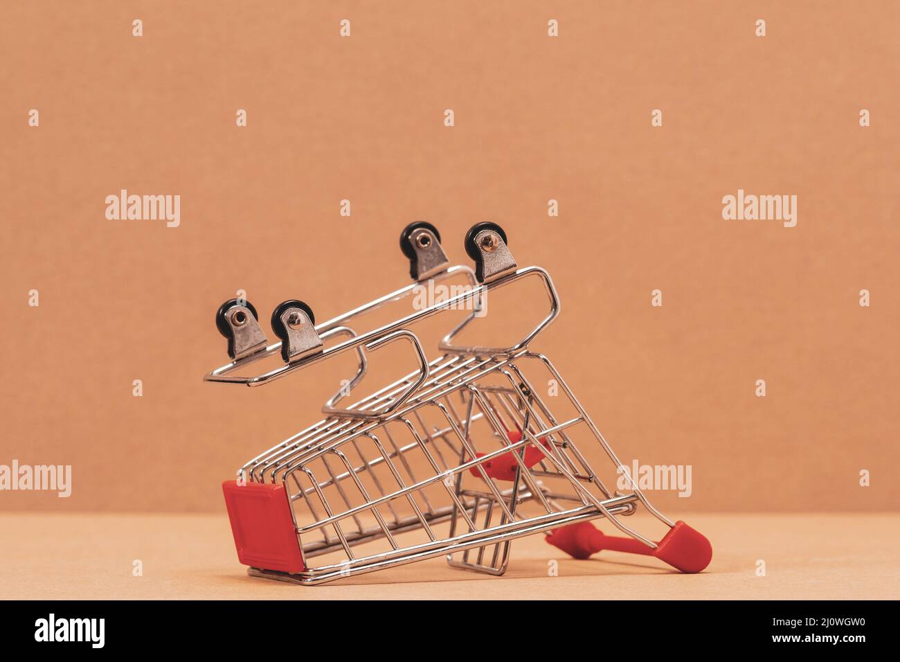 Shopping cart is upturned Stock Photo - Alamy
