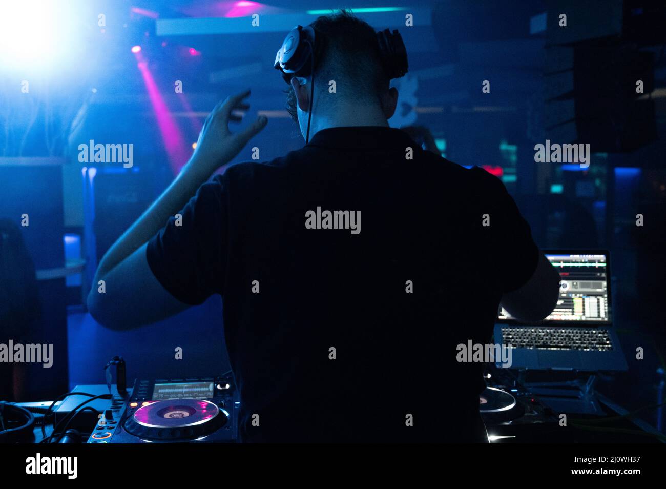 Dj mixing at party festival with light and smoke in background - Summer ...