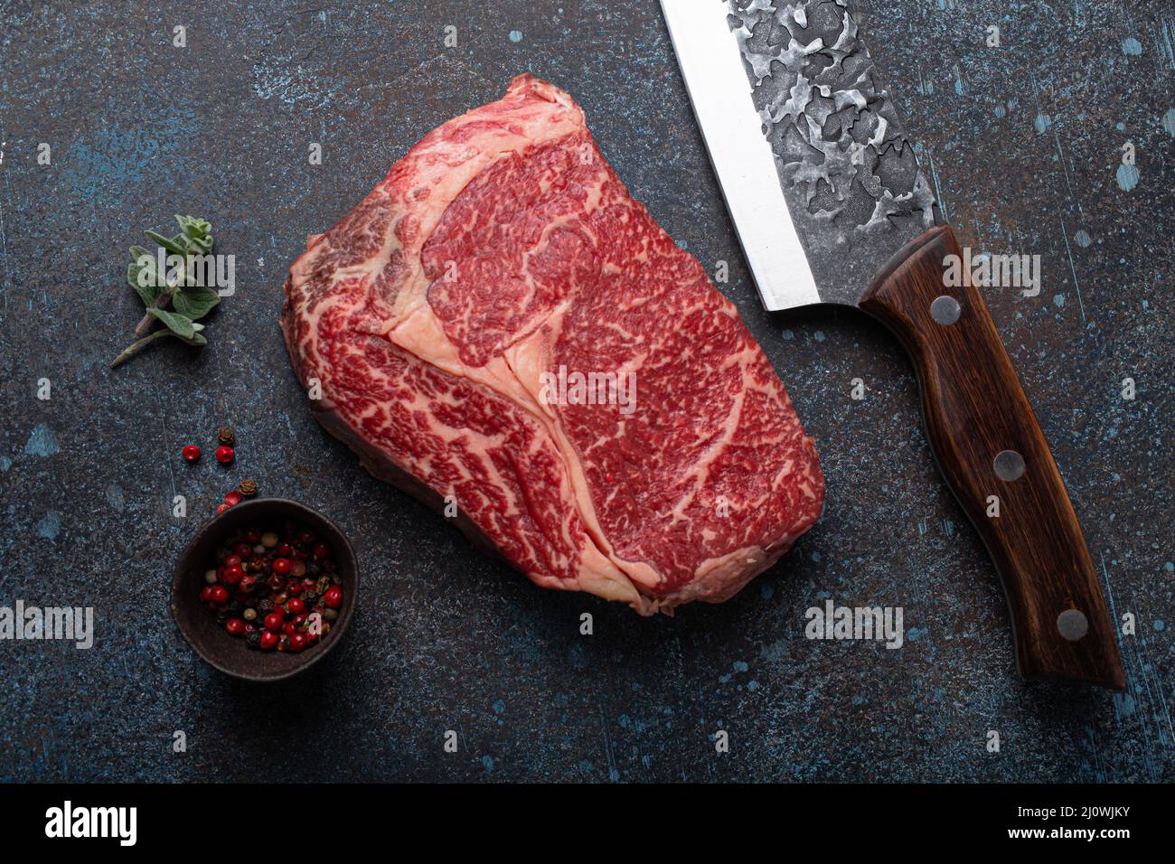 Raw meat beef marbled prime cut steak Ribeye on rustic concrete kitchen ...