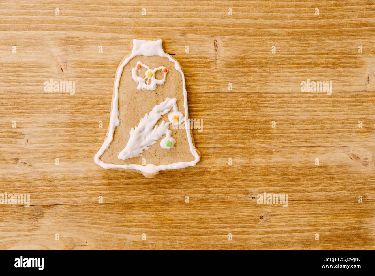 Colorful Christmas gingerbread in the shape of bell decorated with ...