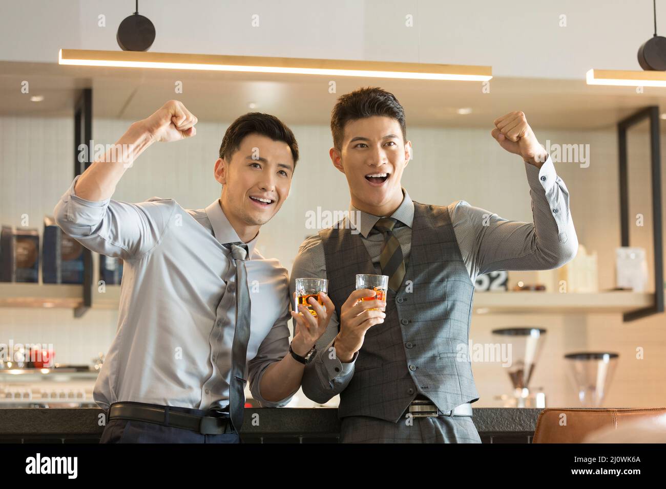 Chinese business colleagues celebrate success Stock Photo - Alamy