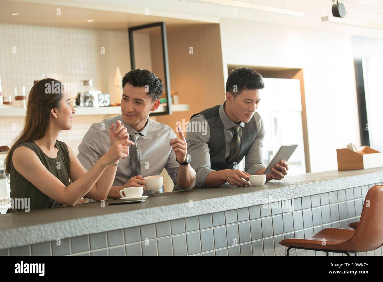 Successful Chinese businessmen chat in coffee shops Stock Photo - Alamy