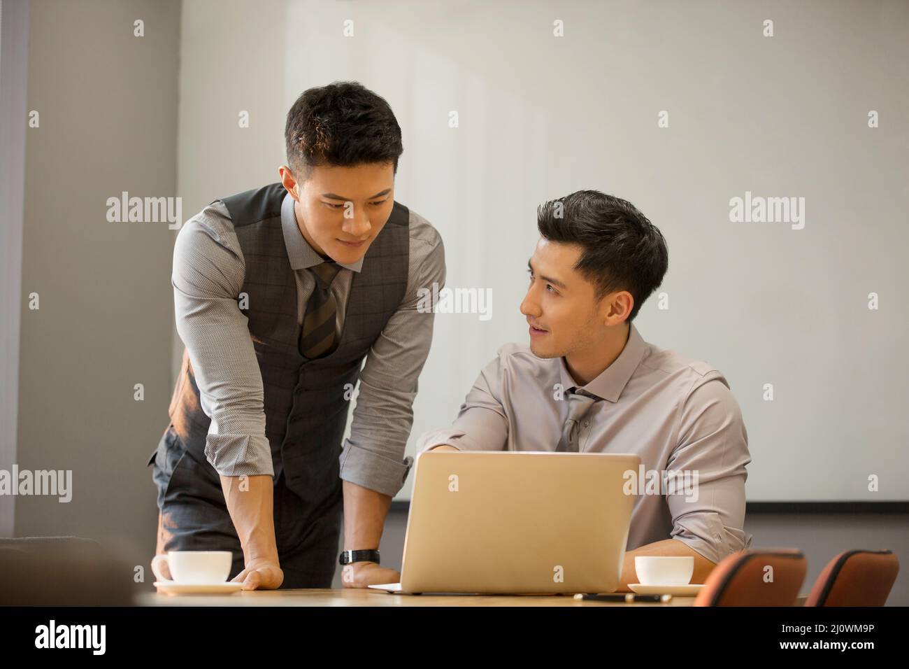 Chinese businessmen planning in office meeting room Stock Photo - Alamy