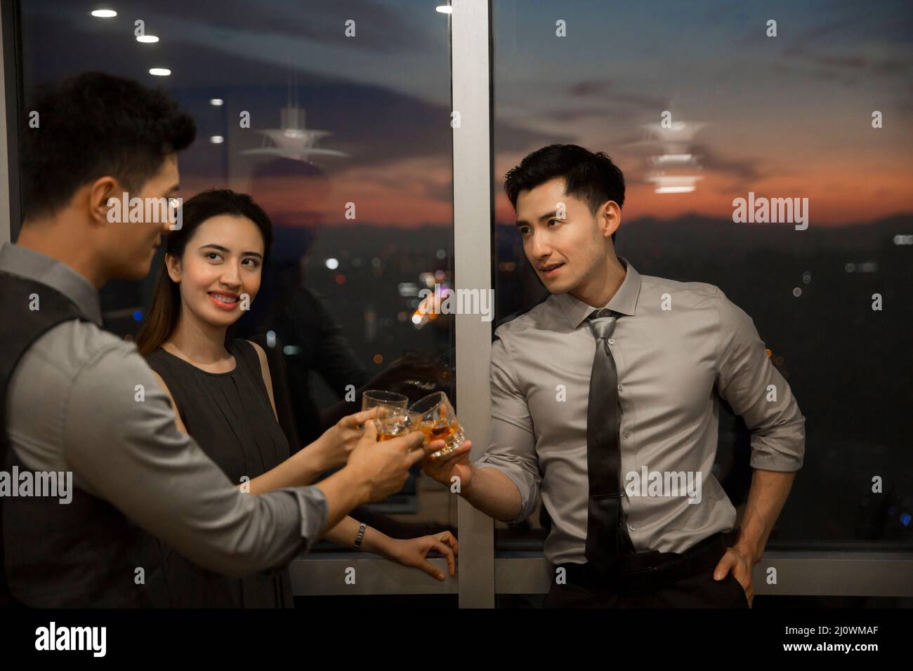 Chinese business colleagues toast to celebrate success in meeting room ...
