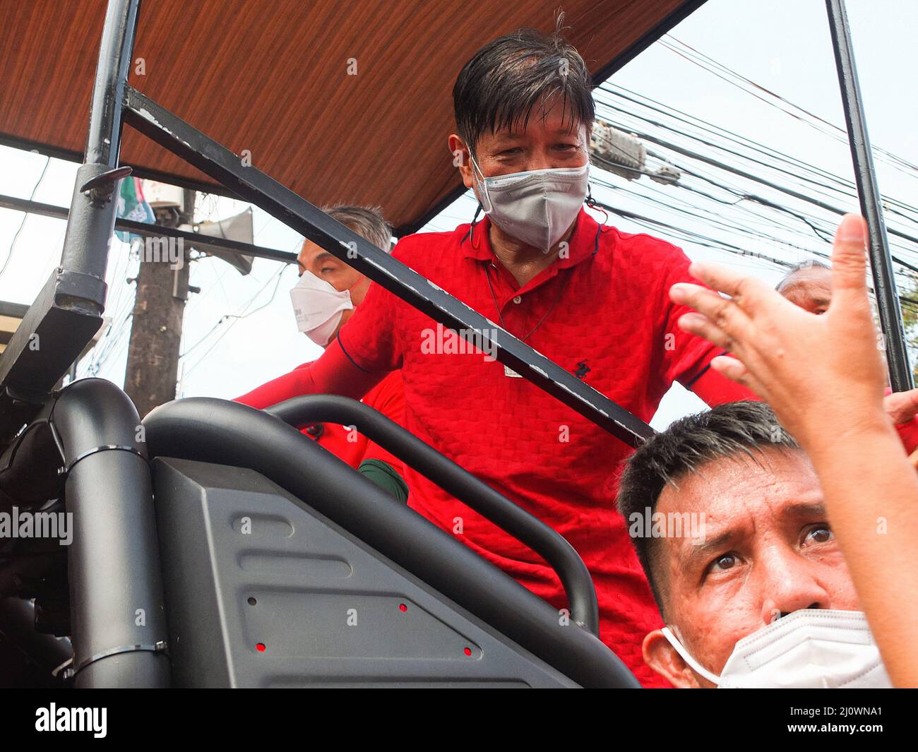 Former Senator Ferdinand "Bongbong" Marcos Jr. reaching out his hand to ...