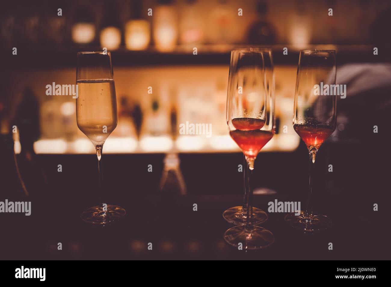 Wine placed on a bar counter Stock Photo - Alamy