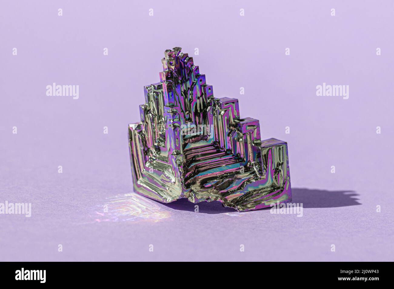 Synthetic bismuth Bismuthum crystal with iridescent oxide film on pink ...